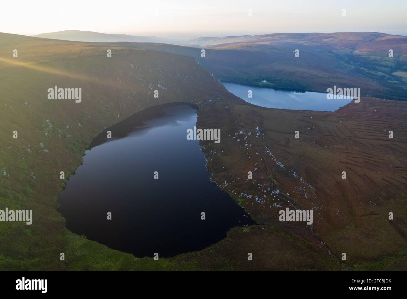 An aerial view of sunset over lough Bray upper in Wicklow Mountains ...