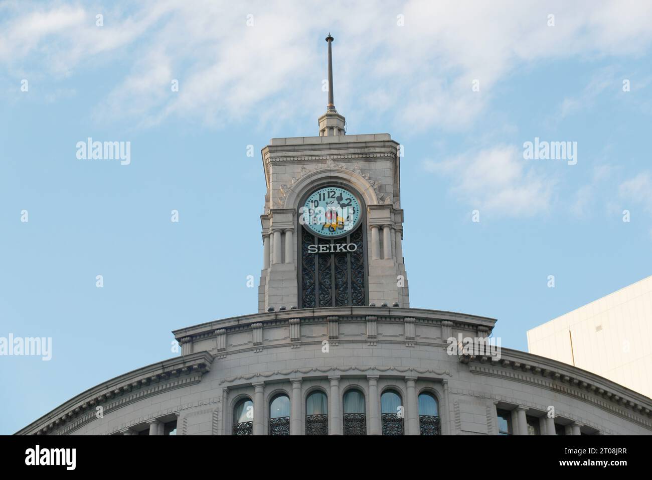 A Mickey Mouse clockface is displayed on the famous clock tower on top ...