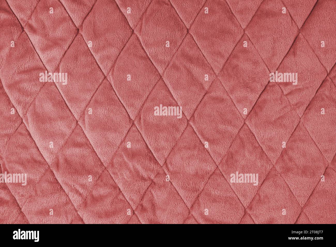 Quilted velours fabric background. Red texture blanket or puffer jacket ...