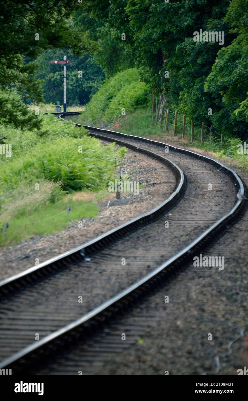 twisting uneven rail track with stop signal at the end waybourne ...