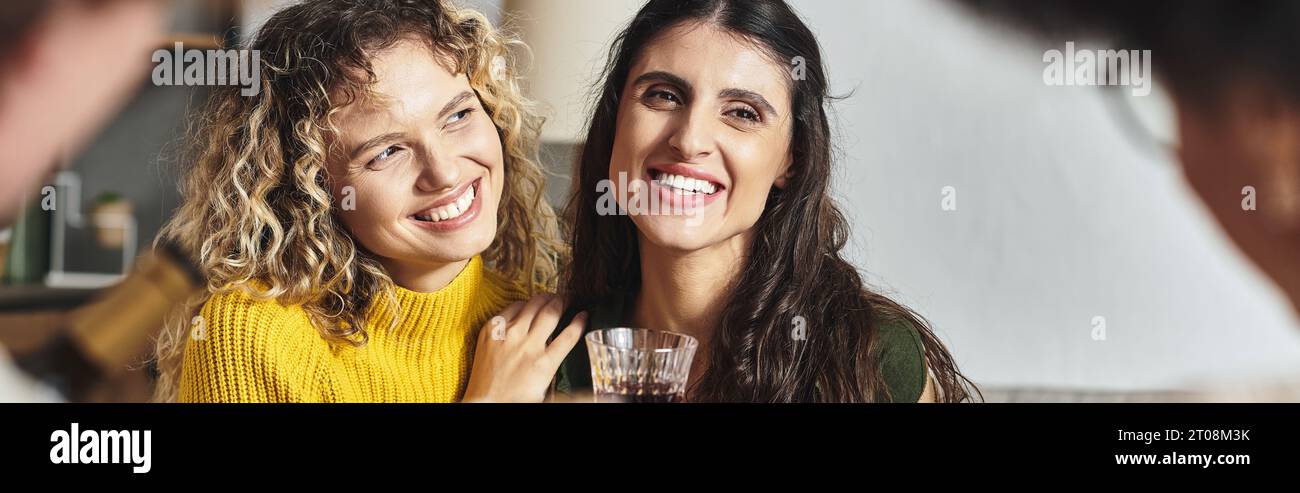 happy lgbt couple surrounded by their loving family hugging and ...