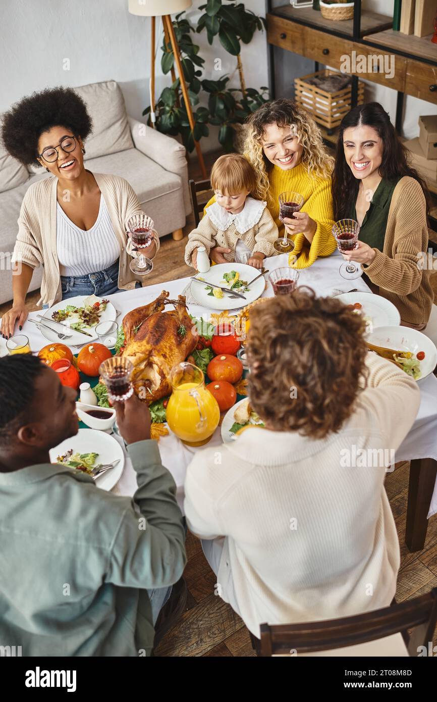 Happy multiethnic friends and family having a good time together during ...