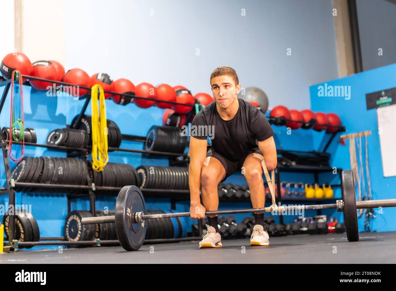 Portrait of a disabled man dead lifting with an amputated arm Stock ...