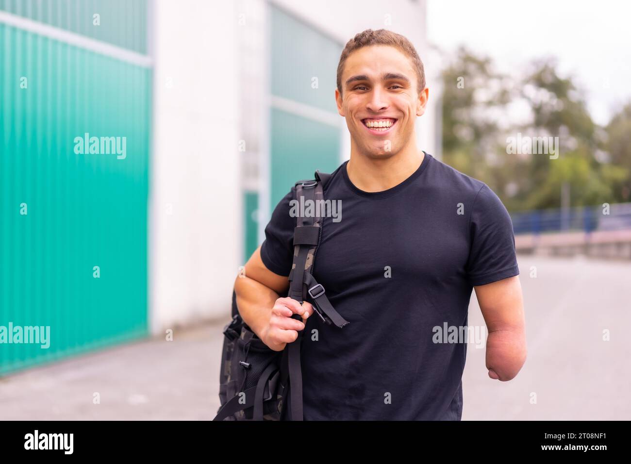 Happy and young disabled sports man arriving at the gym Stock Photo - Alamy