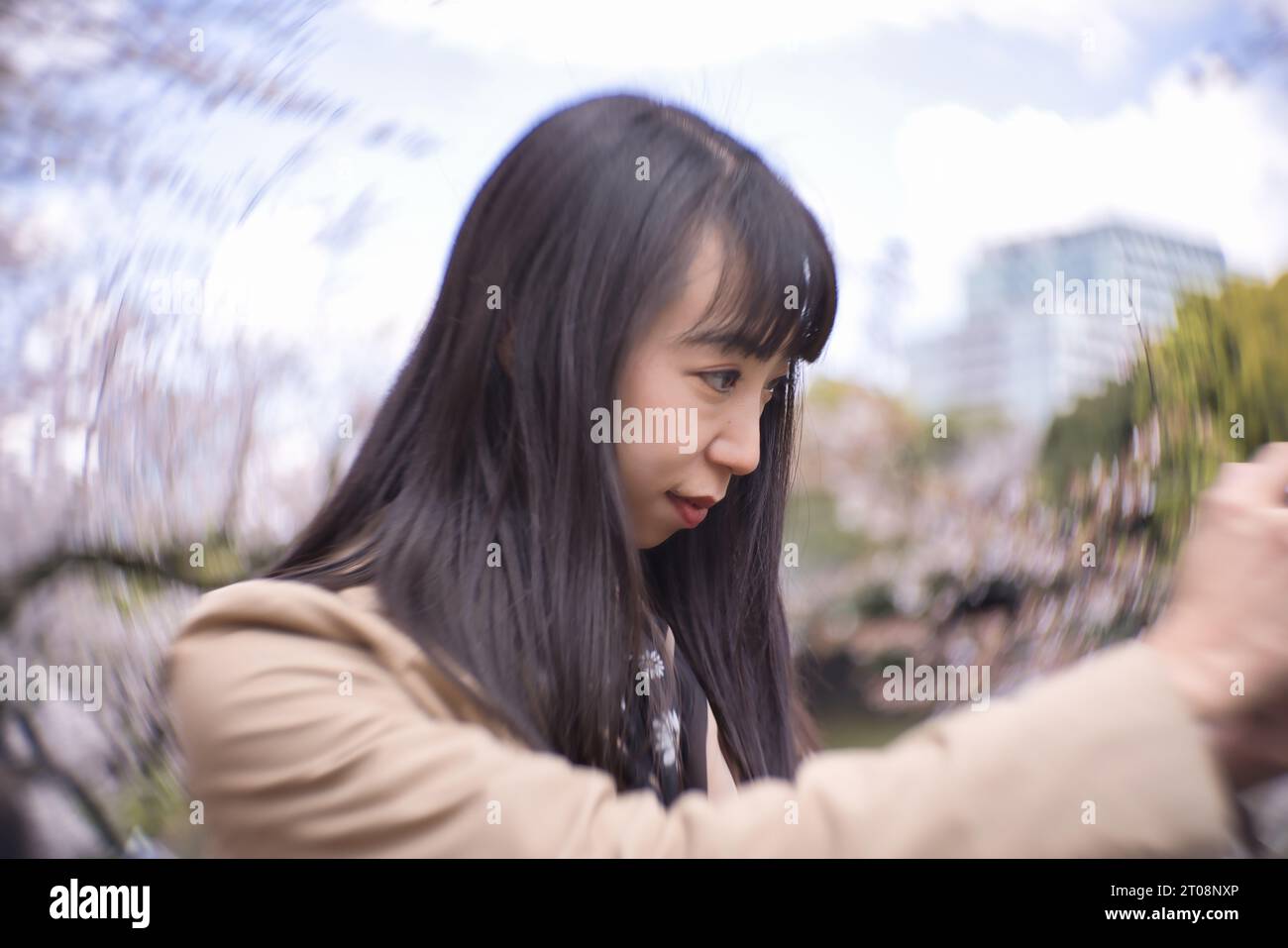 A portrait of Japanese woman shooting by mirrorless camera behind ...