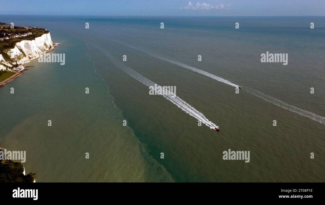 Aerial view of two commercial, Rigid Inflatable Boats, passing by St ...