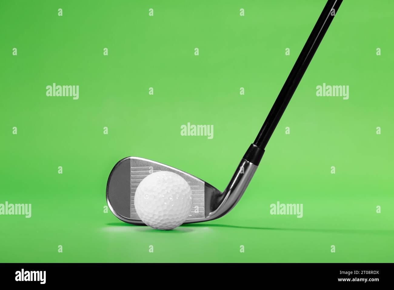 Fairway Iron Golf Club with Ball on a Green Background with Copy Space ...