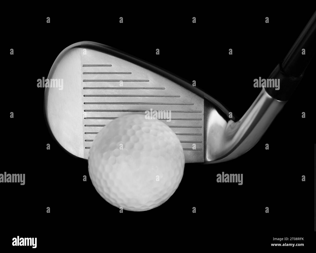 Closeup of a Iron Golf Club Iron Head with Ball on a Black Background ...