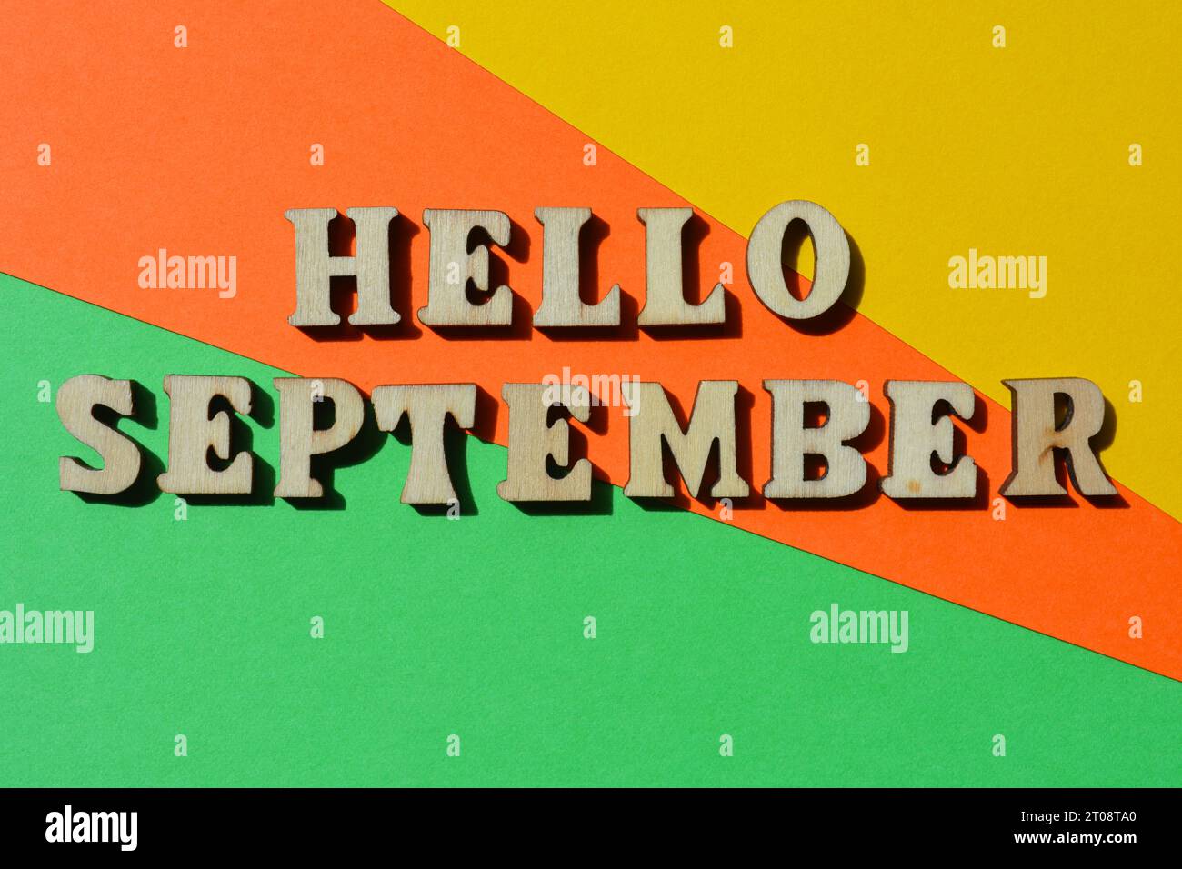 Hello September, words in wooden alphabet letters isolated on colourful ...