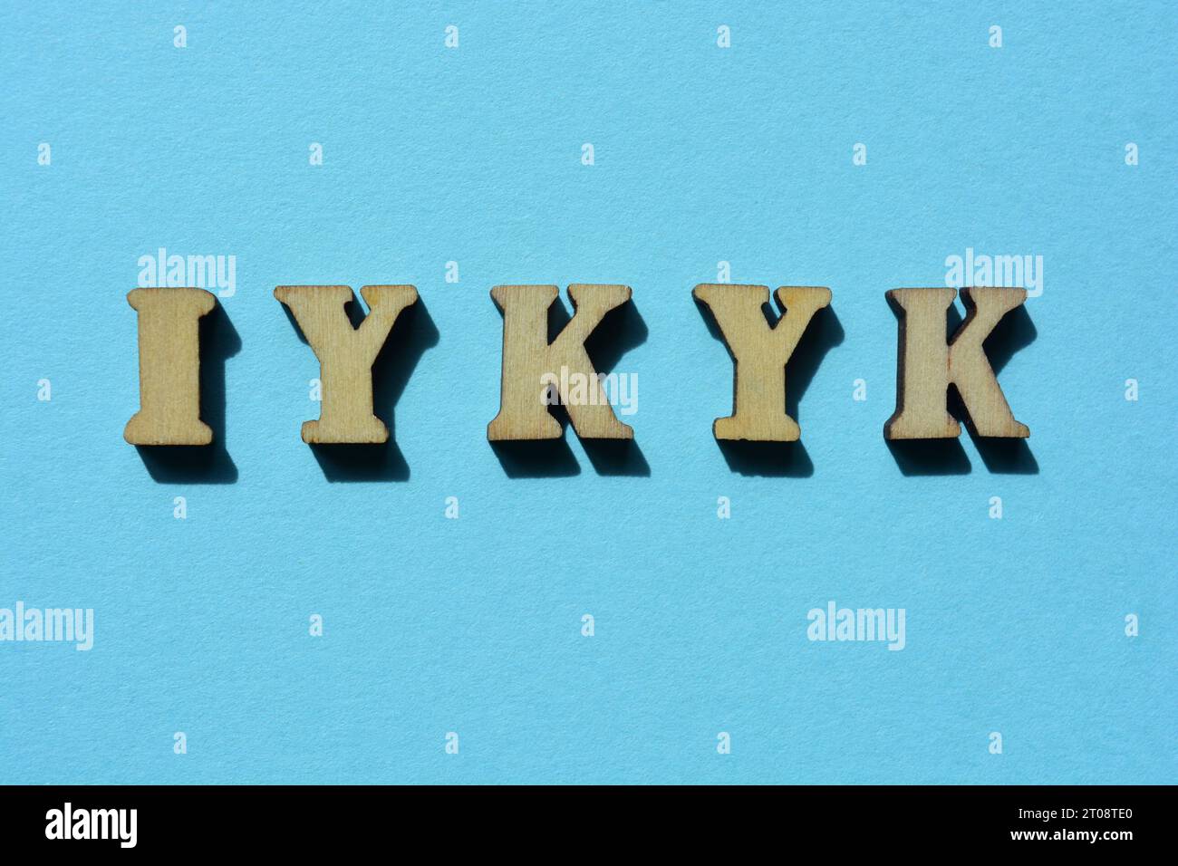 IYKYK, acronym for If You Know You Know in wooden alphabet letters ...