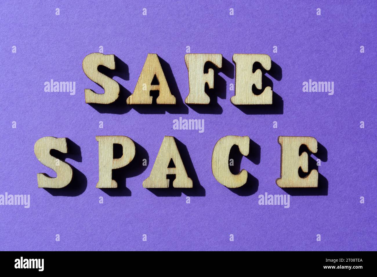 Safe Space, words in wooden alphabet letters isolated on purple ...