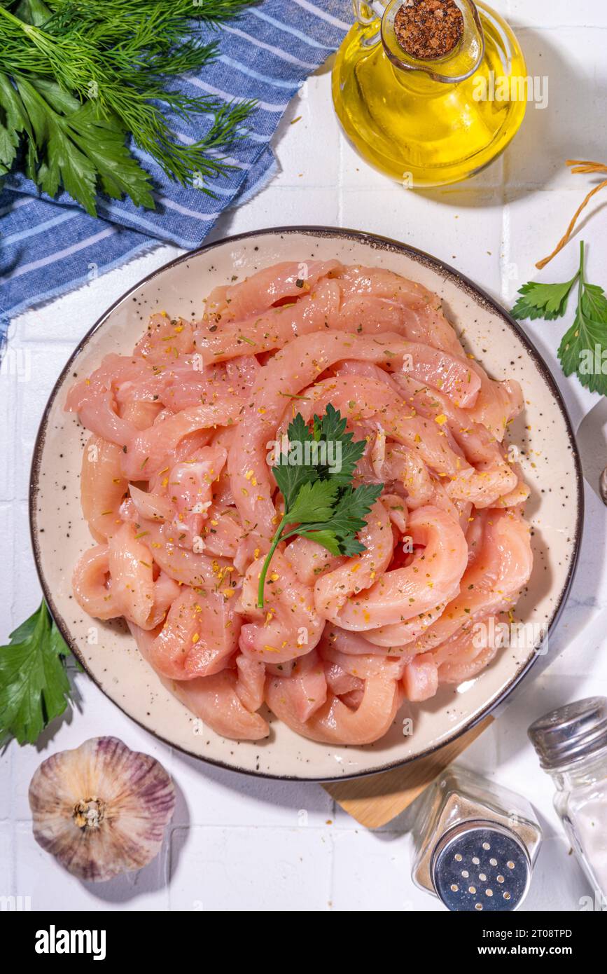 Cooking diet white poultry meat background. Fresh sliced chicken strips ...