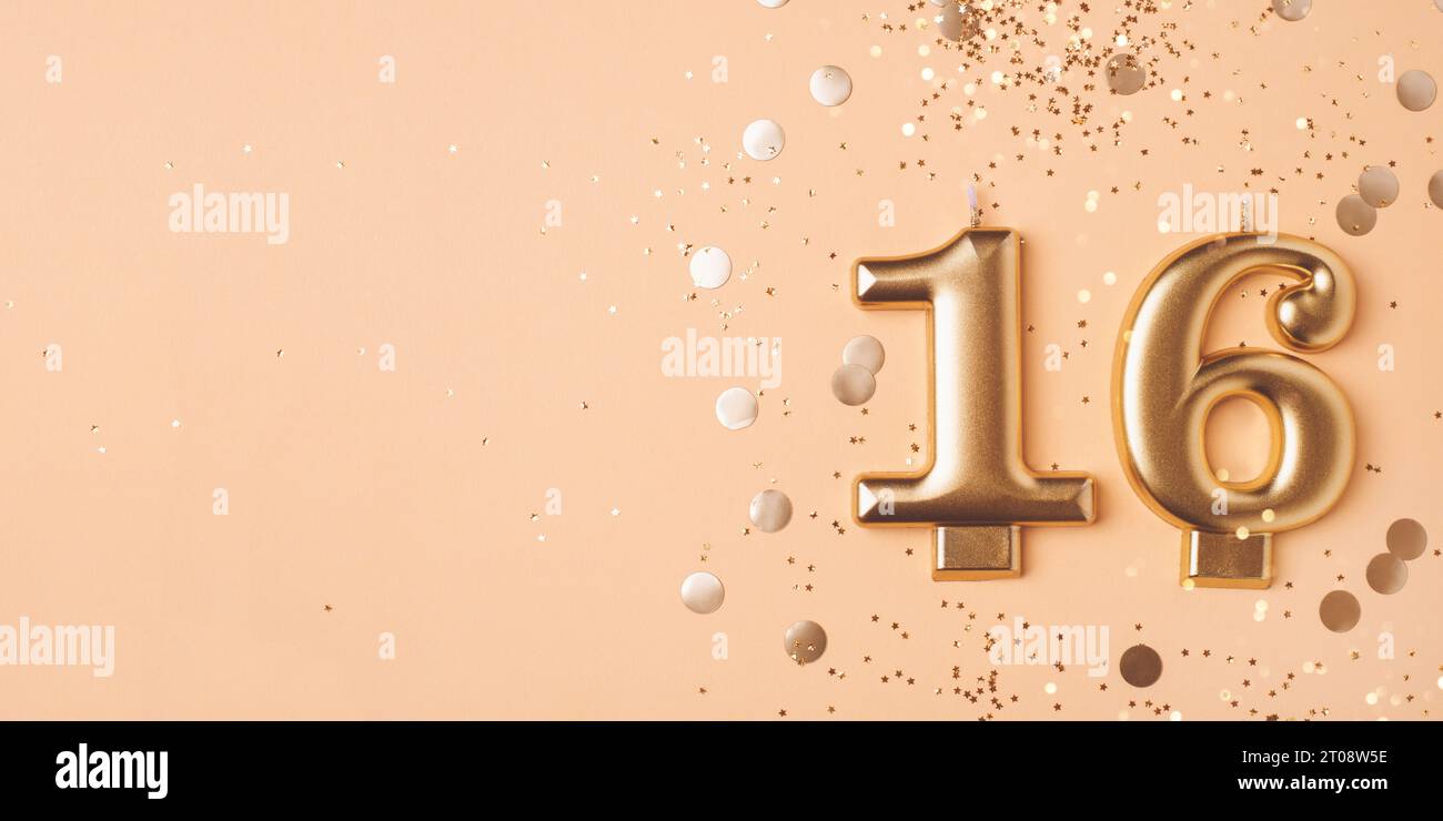 Gold candles in the form of number sixteen Stock Photo - Alamy