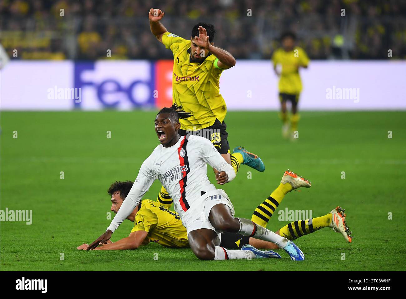 DORTMUND, GERMANY - 04.10.23: Rafael Leao, Emre Can, Mats Hummels. The ...