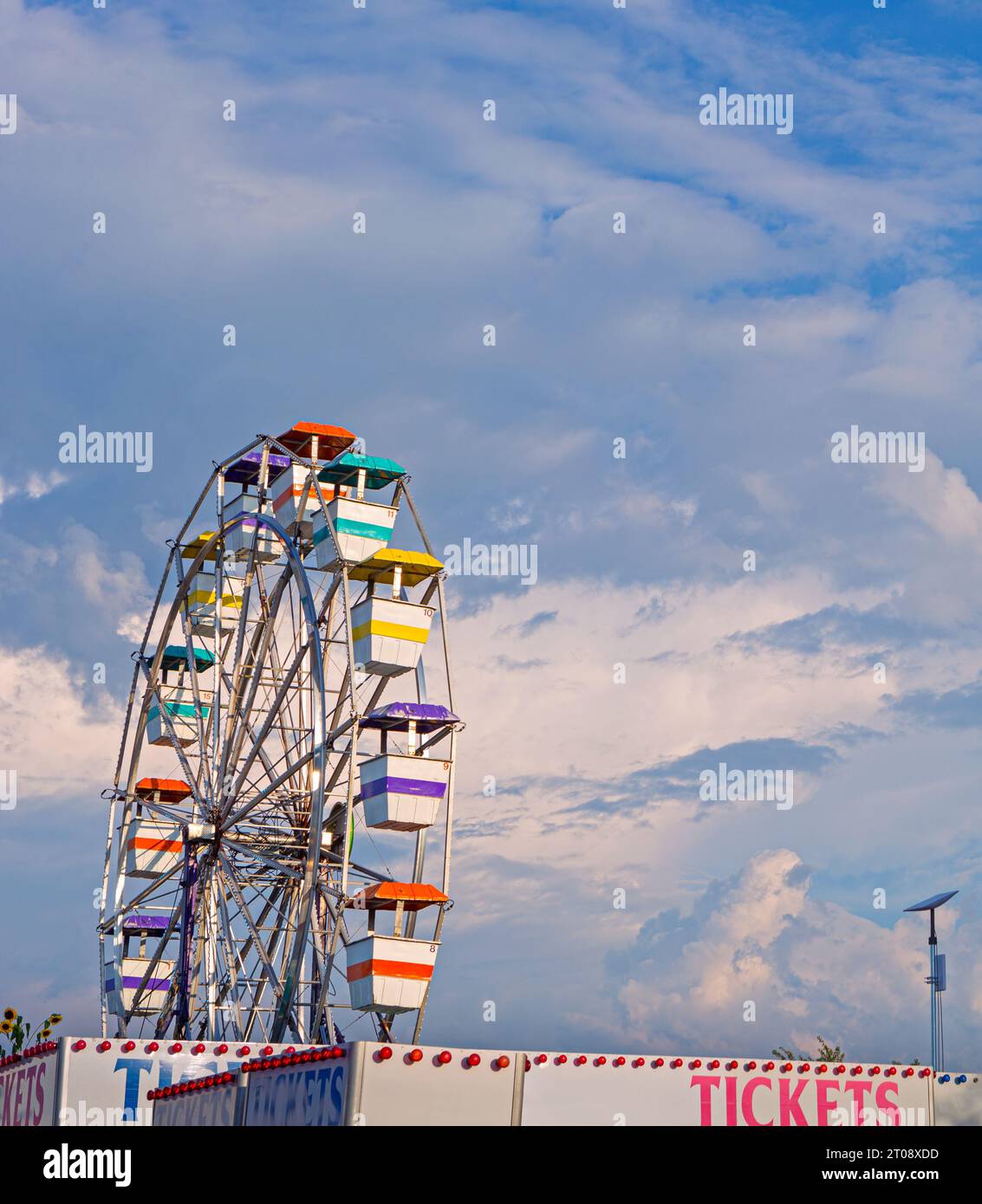 Colorful ferris wheel at a local county fair Stock Photo - Alamy
