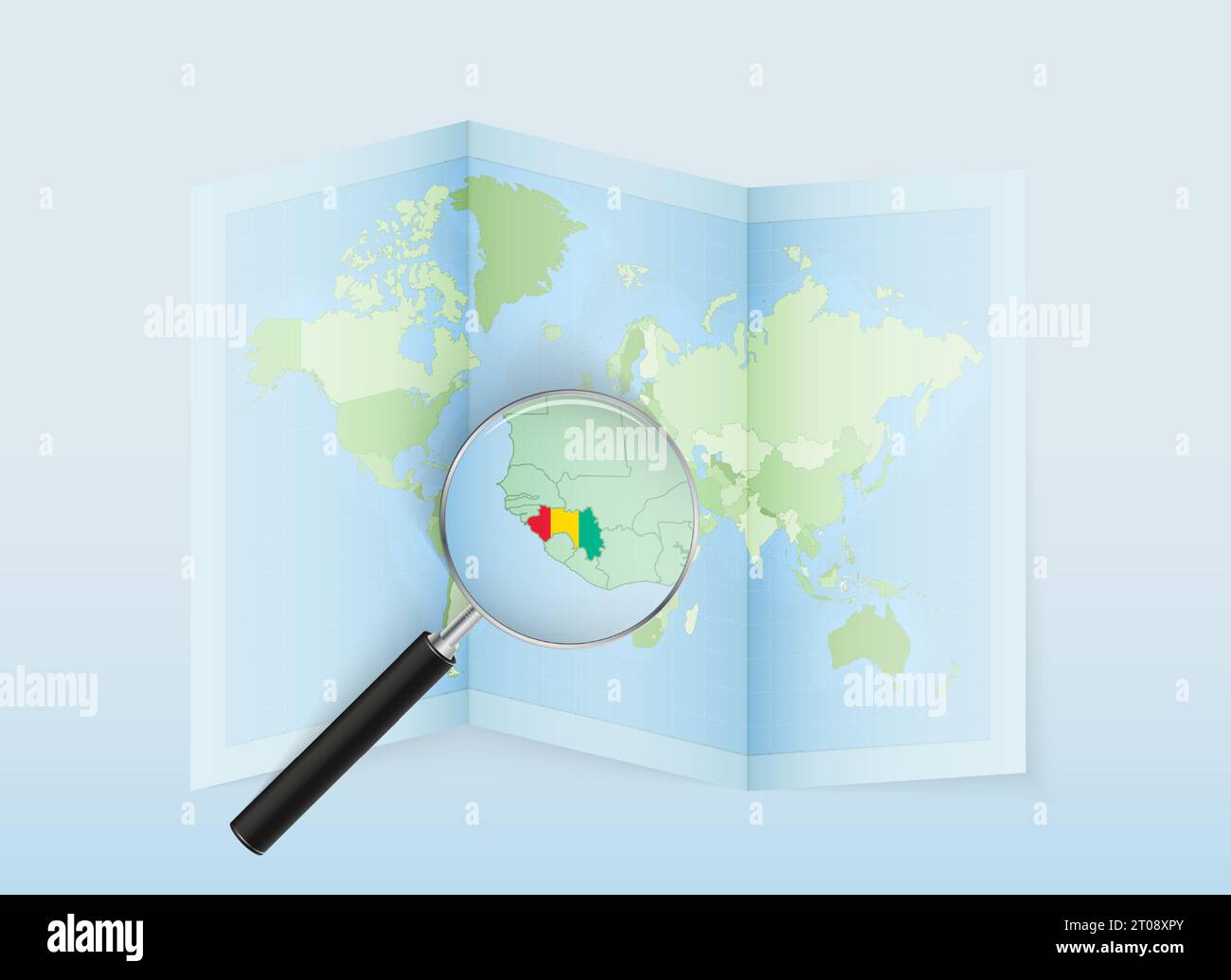 A folded world map with a magnifying lens pointing towards Guinea. Map ...