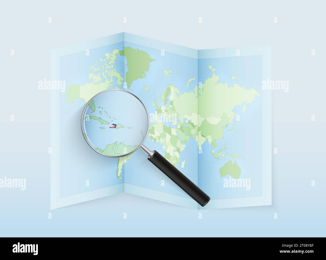 A folded world map with a magnifying lens pointing towards Haiti. Map ...
