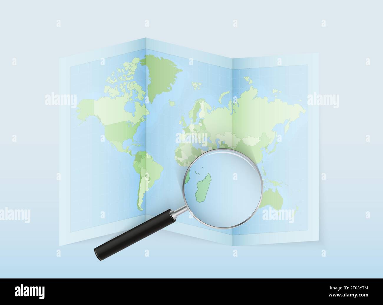 A folded world map with a magnifying lens pointing towards Mauritius ...