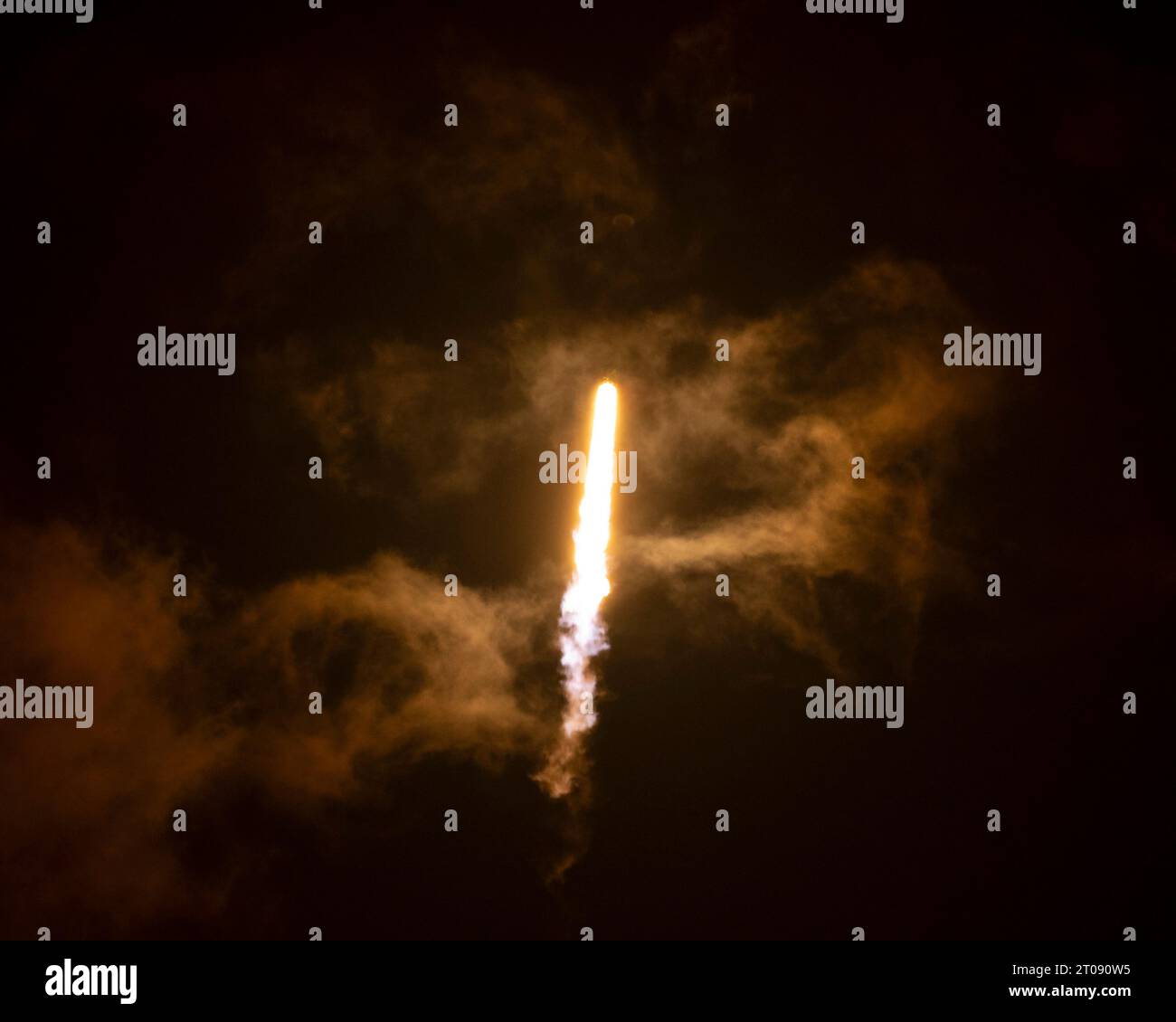 The SpaceX Falcon 9 rocket passes through a thin clous layer as it ...