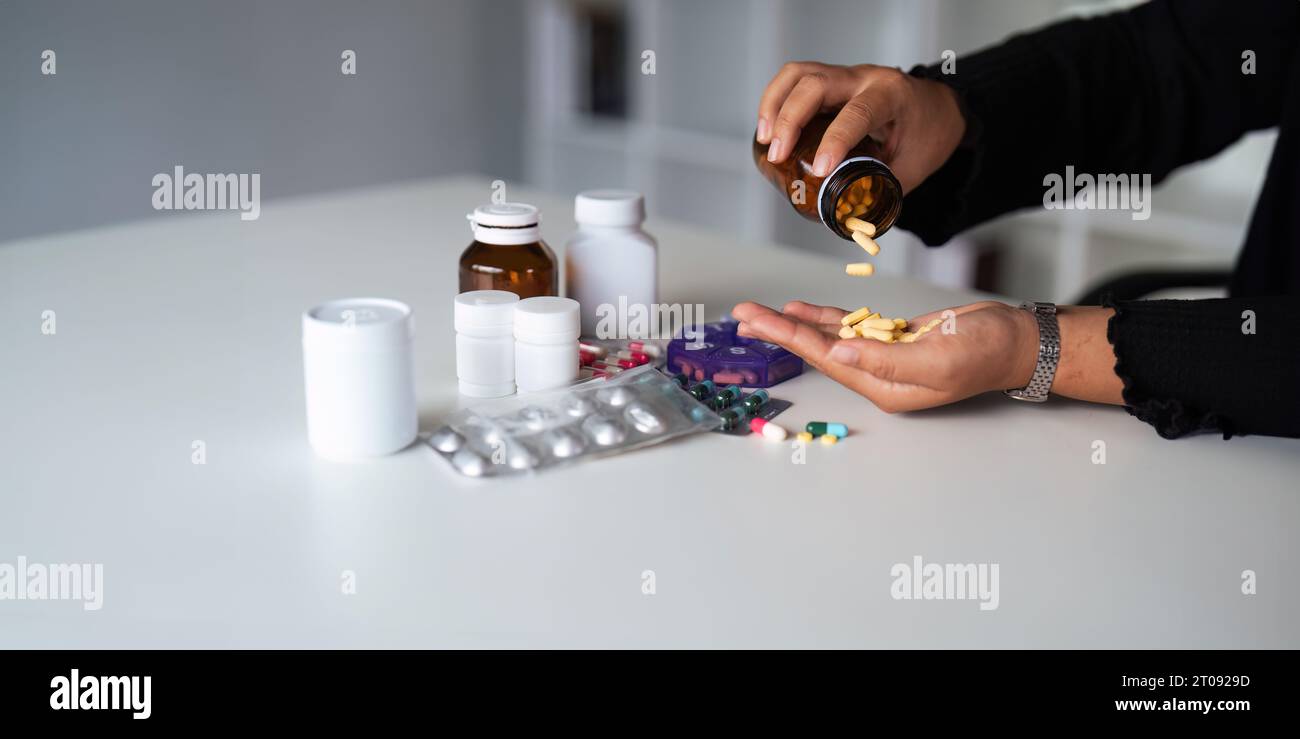 Women organize check the medicine bottle her medication into pill ...
