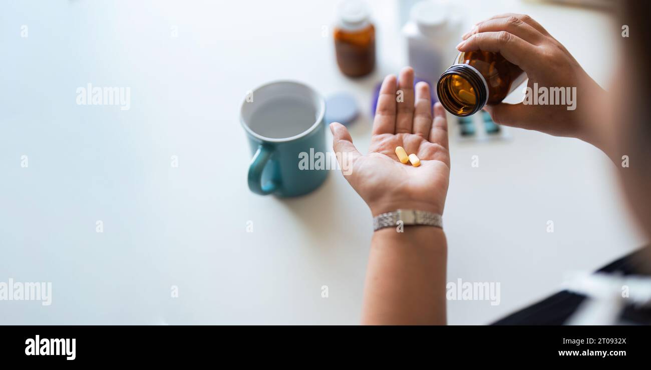 Close up woman holding pill in hand with water feeling sick. female ...