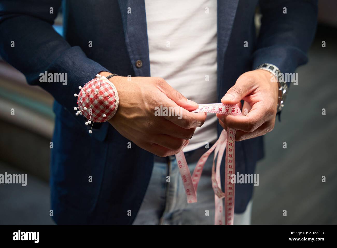 Master tailor using sewing tools in workshop Stock Photo - Alamy
