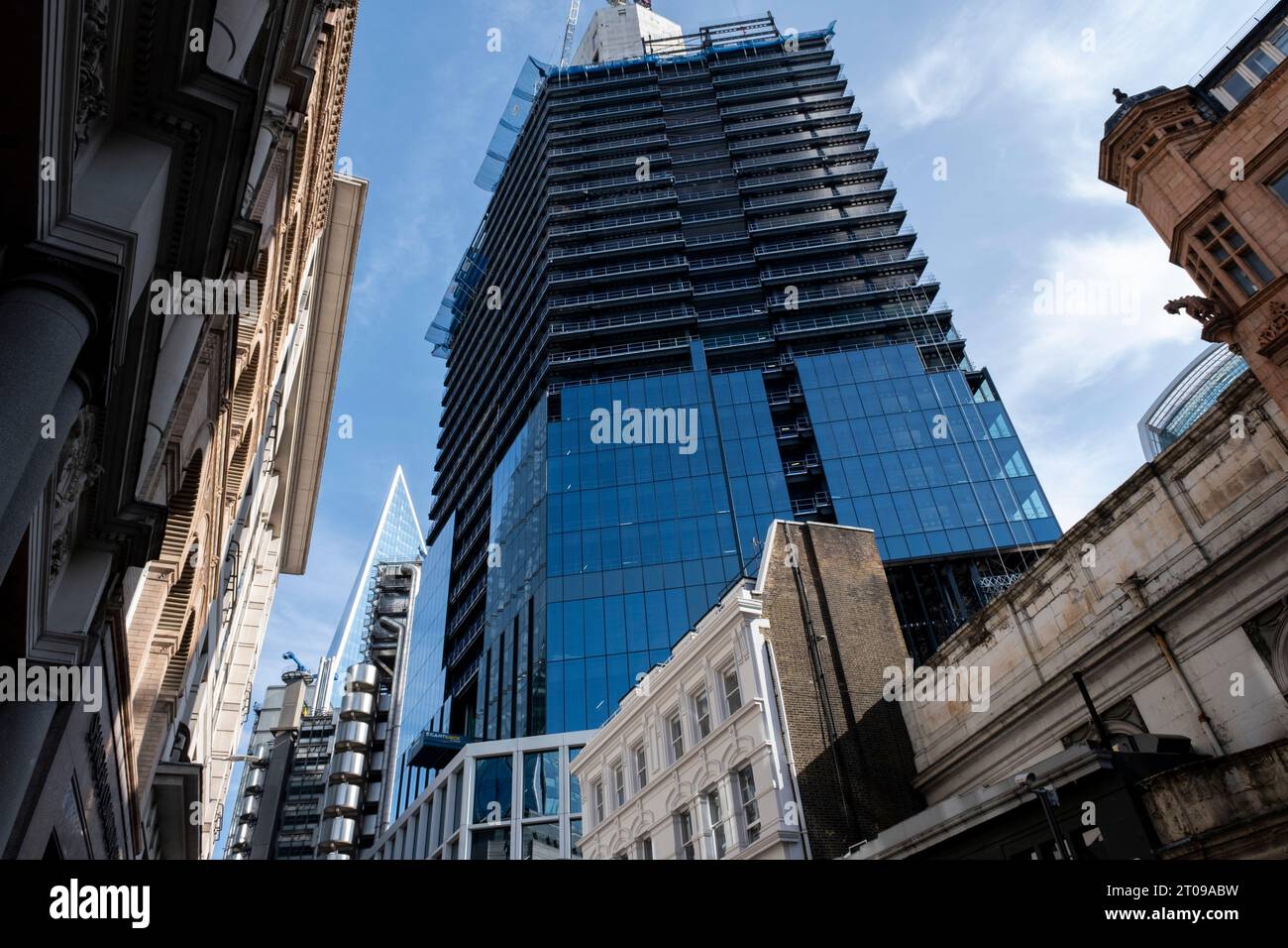 View past old buildings towards the giant glass architectural tower One ...