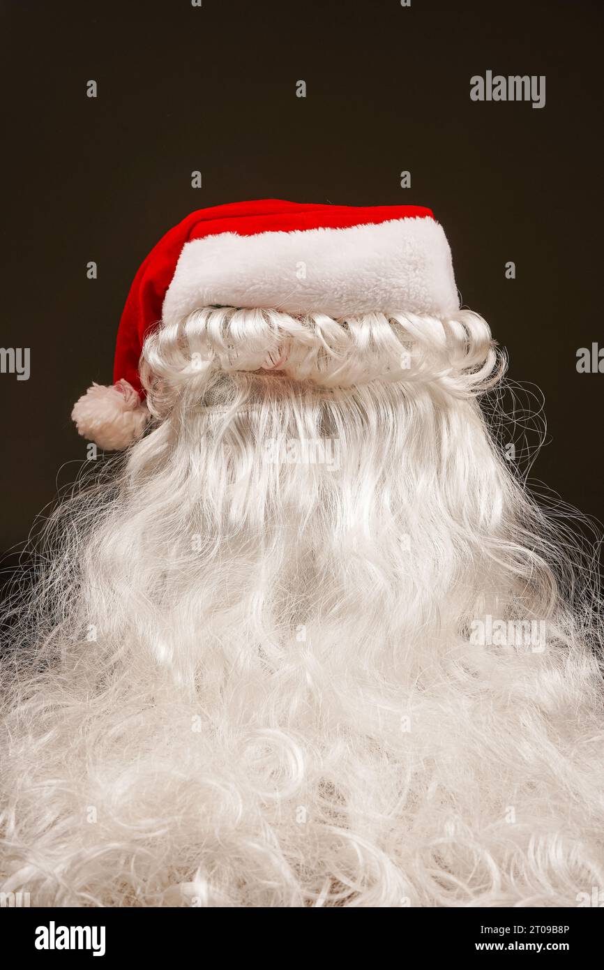 Santa hat and beard on a wooden background. Symbolism of New Year's ...