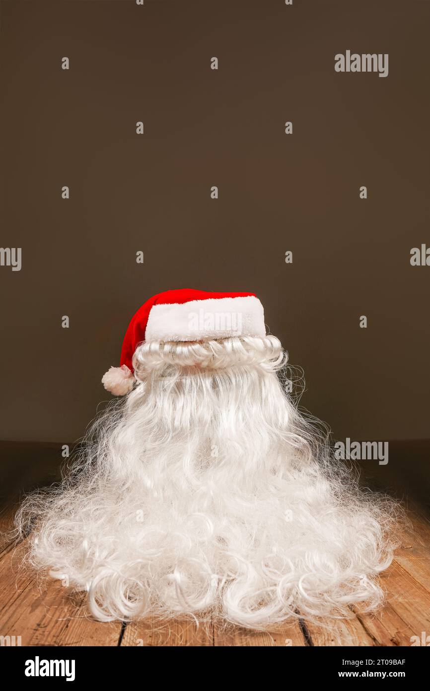 Santa hat and beard on a wooden background. Symbolism of New Year's ...