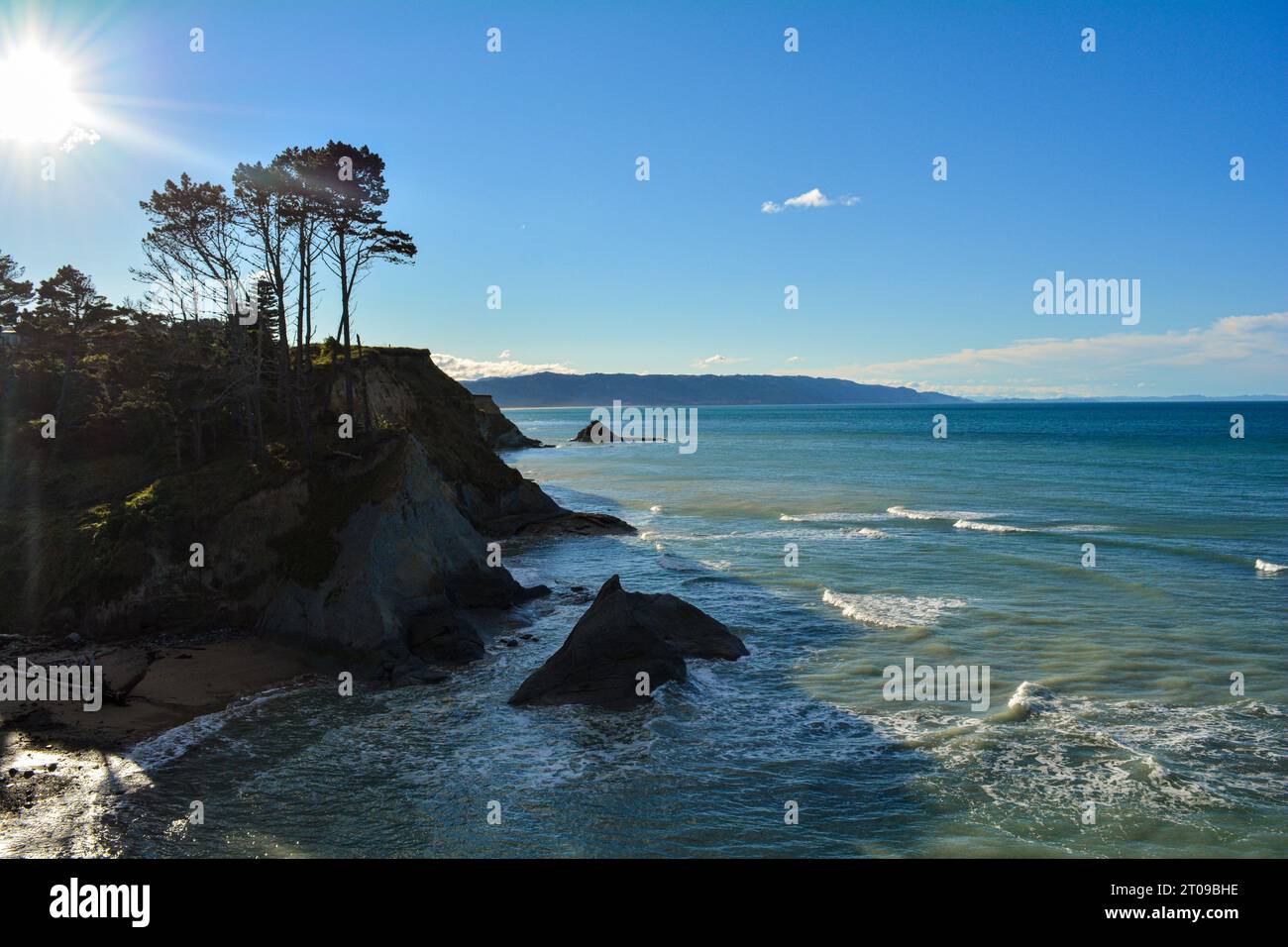 Nature in july in New Zealand. A viewpoint onto a bay with some rock ...