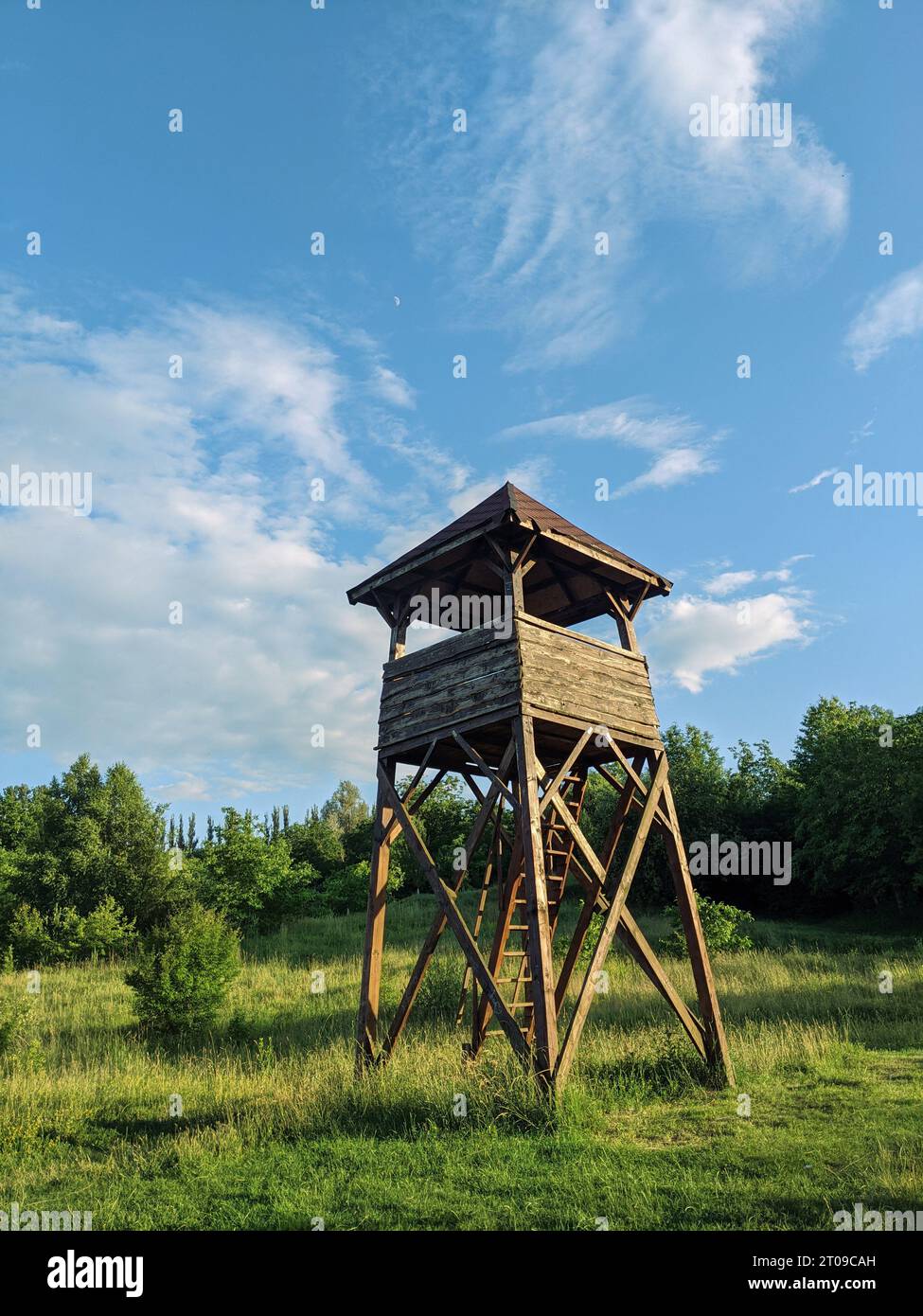 hunters watchout tower. wooden defenders watchtower in forest meadow ...