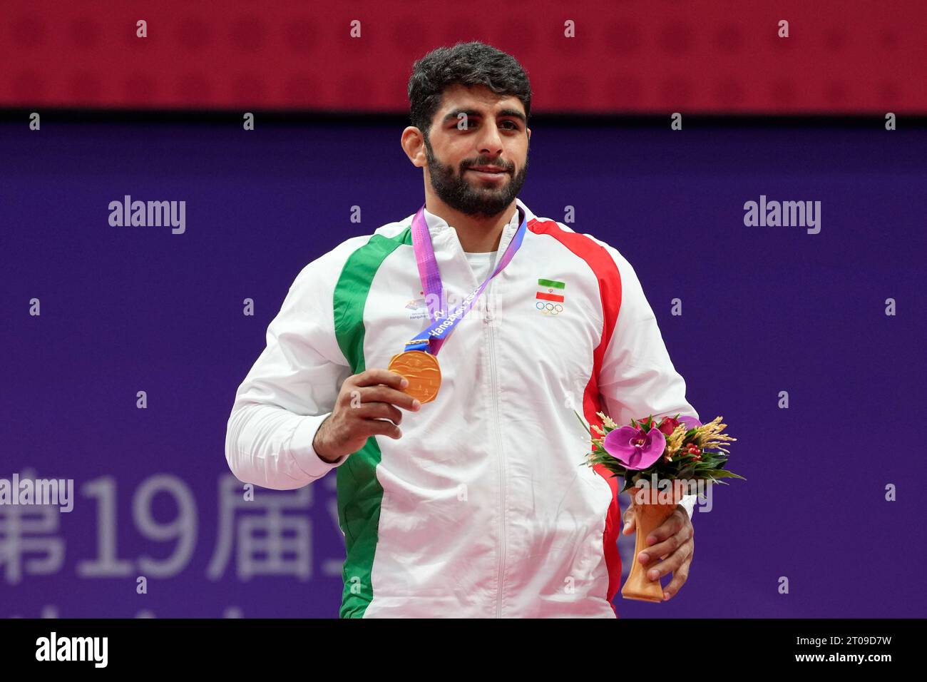 Gold medalist Mohammadhadi Saravi celebrates on the podium during the ...
