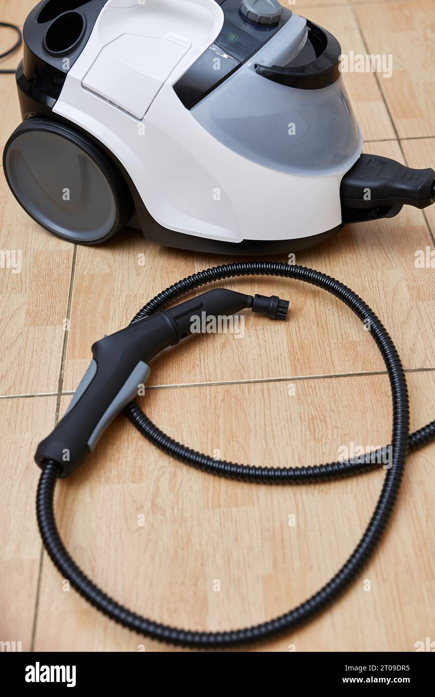 steam generator on the kitchen floor. Home cleaning Stock Photo - Alamy