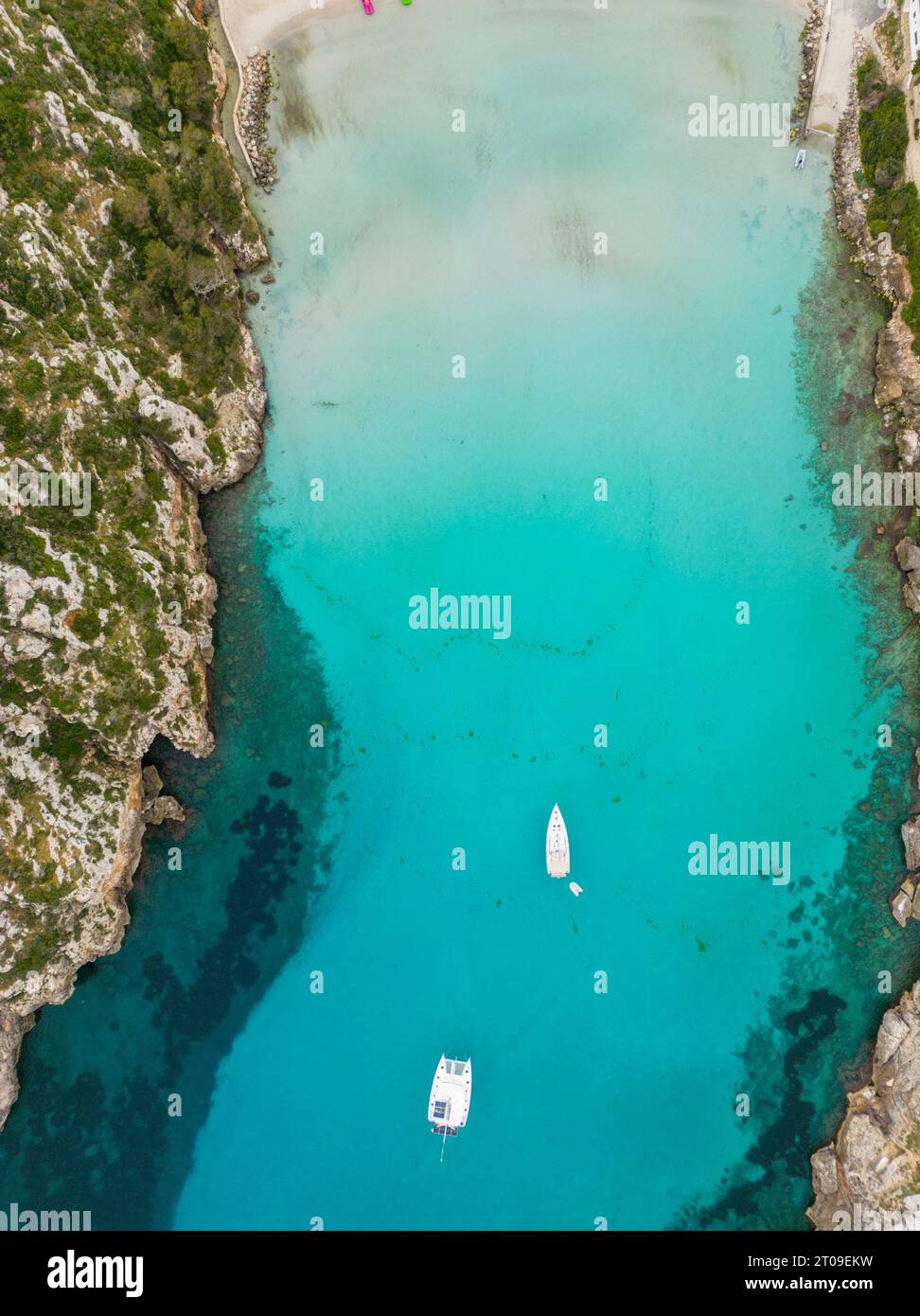 Aerial top view of transparent turquoise water of sea on Menorca island ...