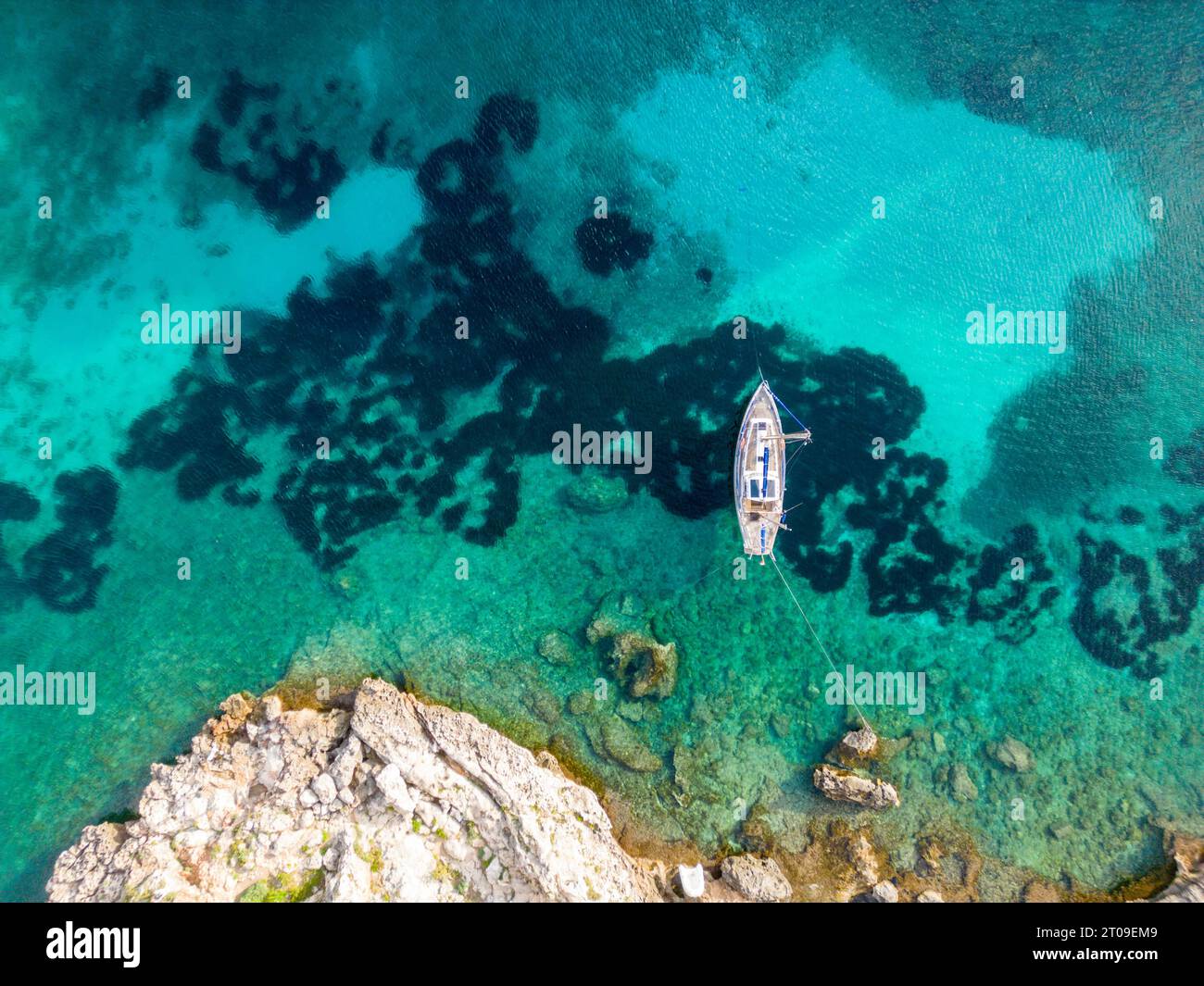Aerial top view of transparent turquoise water of sea on Menorca island ...