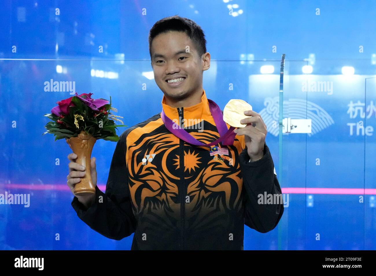 Gold medalist Malaysia's Ng Eain Yow celebrates on the podium during ...