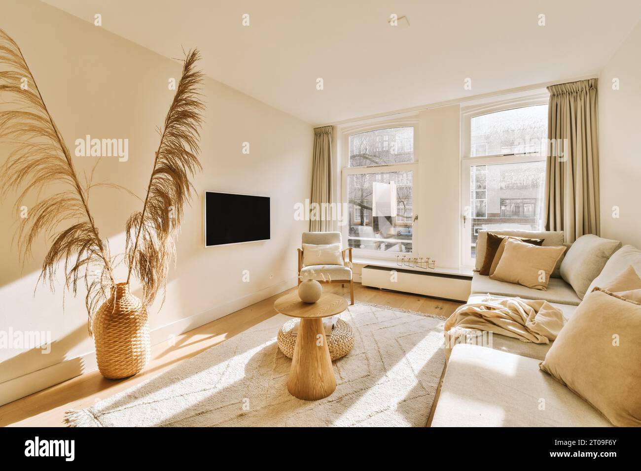 Interior of modern living room with empty couch and chair by bright ...