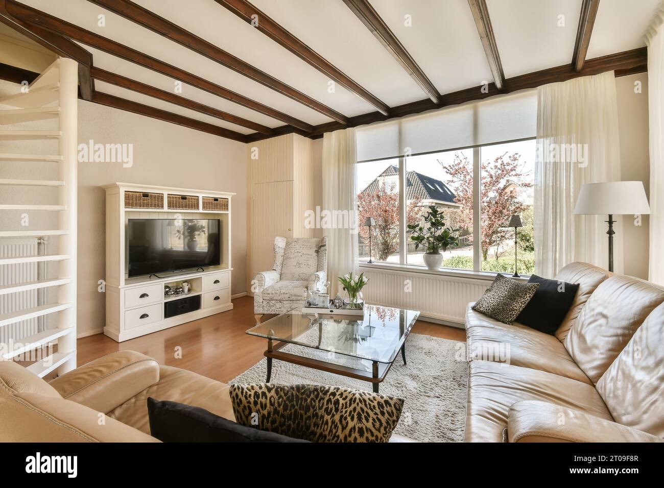 Interior of living room with furniture in front of television set by ...