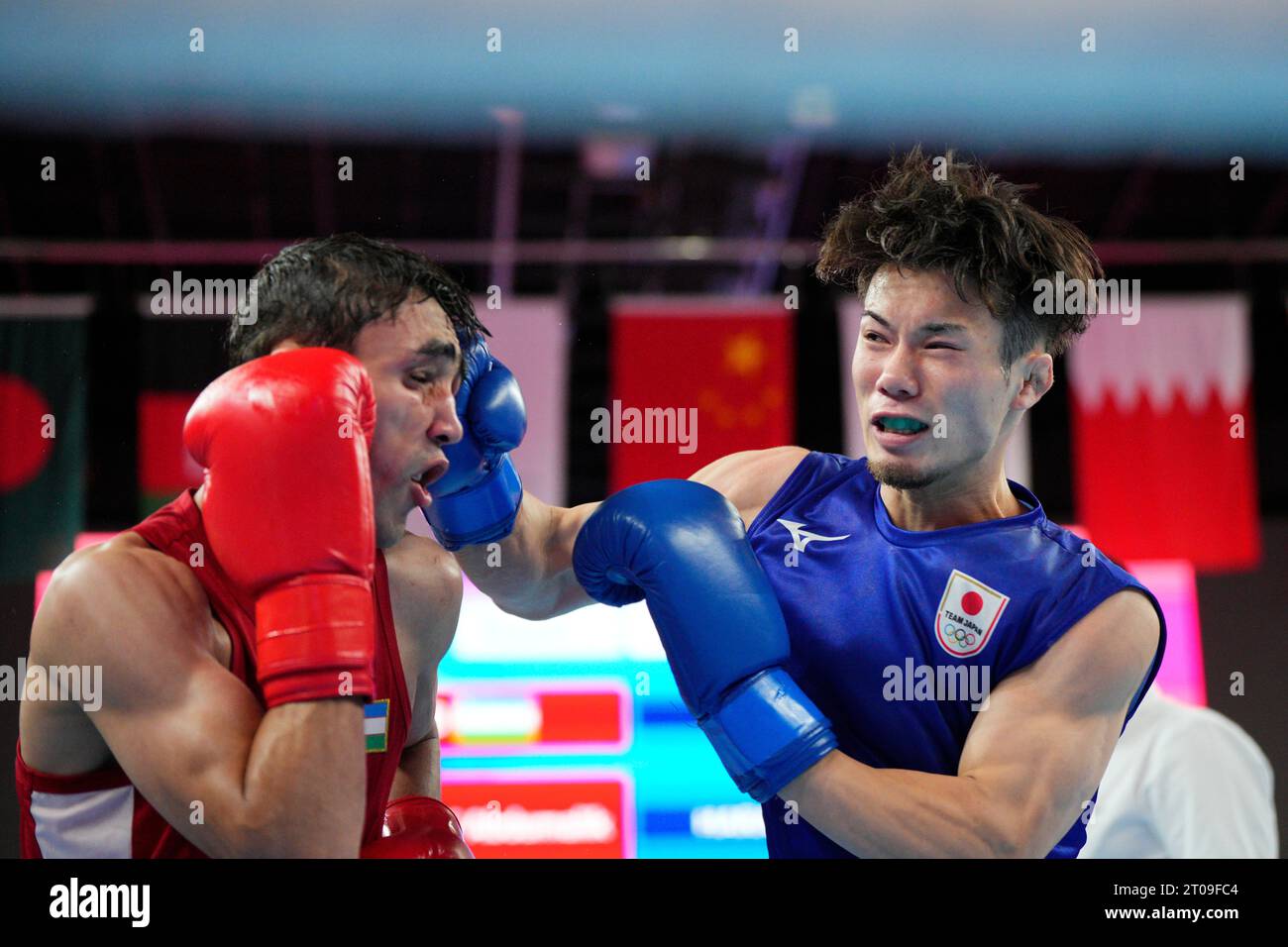Japan's Shudai Harada, right, and Uzbekistan's Abdumalik Khalokov ...