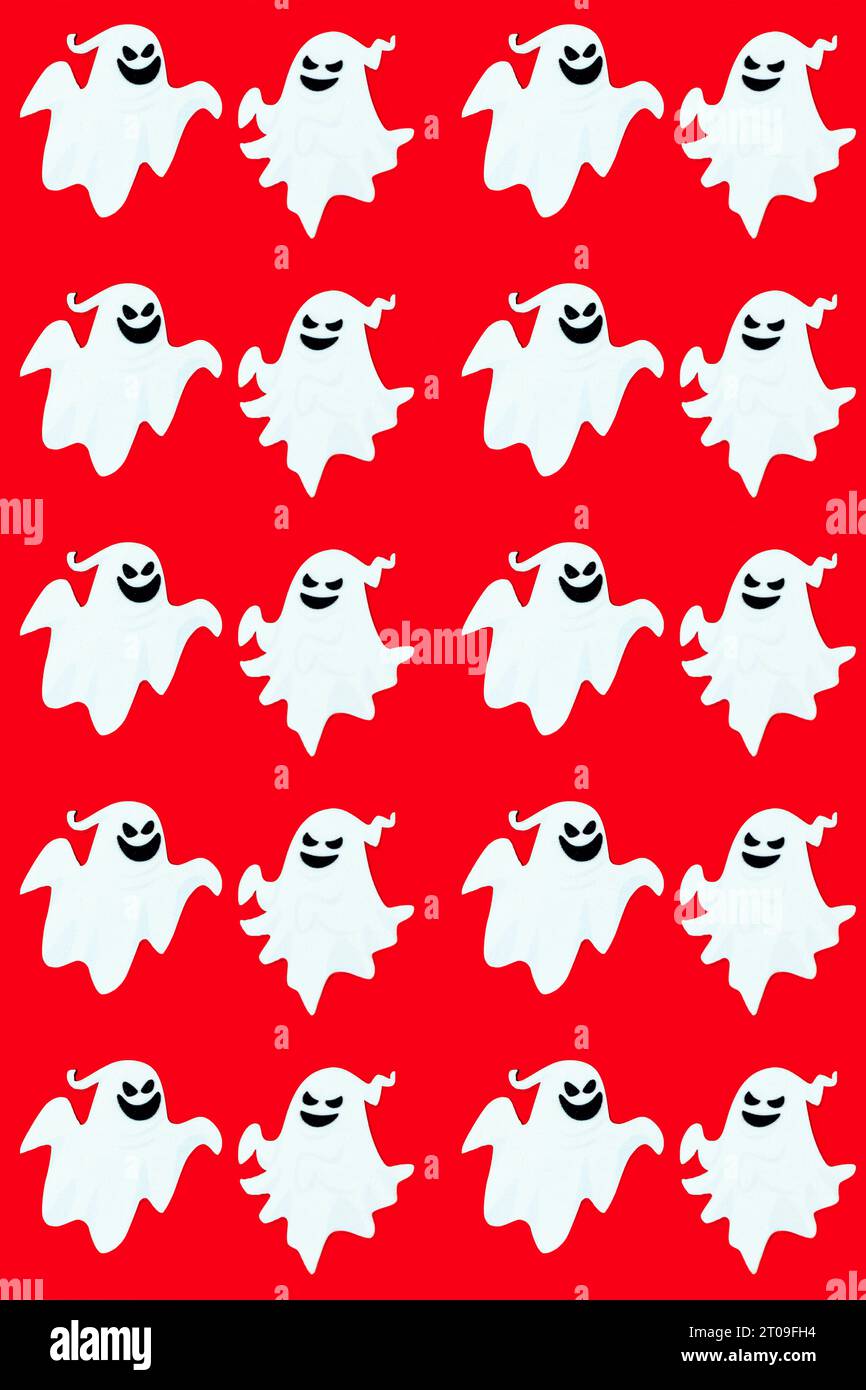 Seamless vector illustration of smiling cartoon ghosts placed in ...