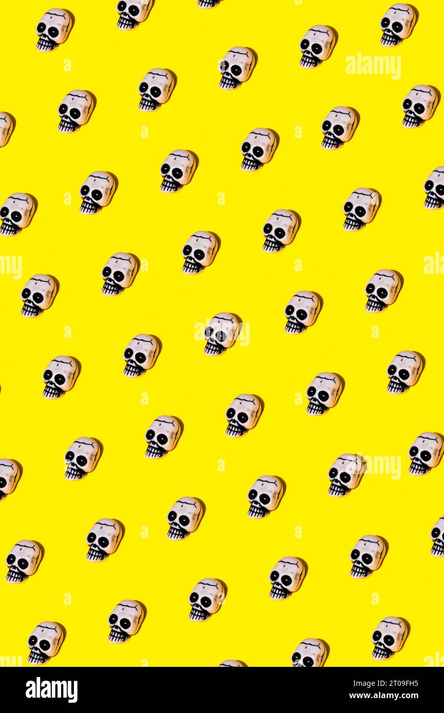 Vector illustration of small human skulls with creepy paint placed in ...