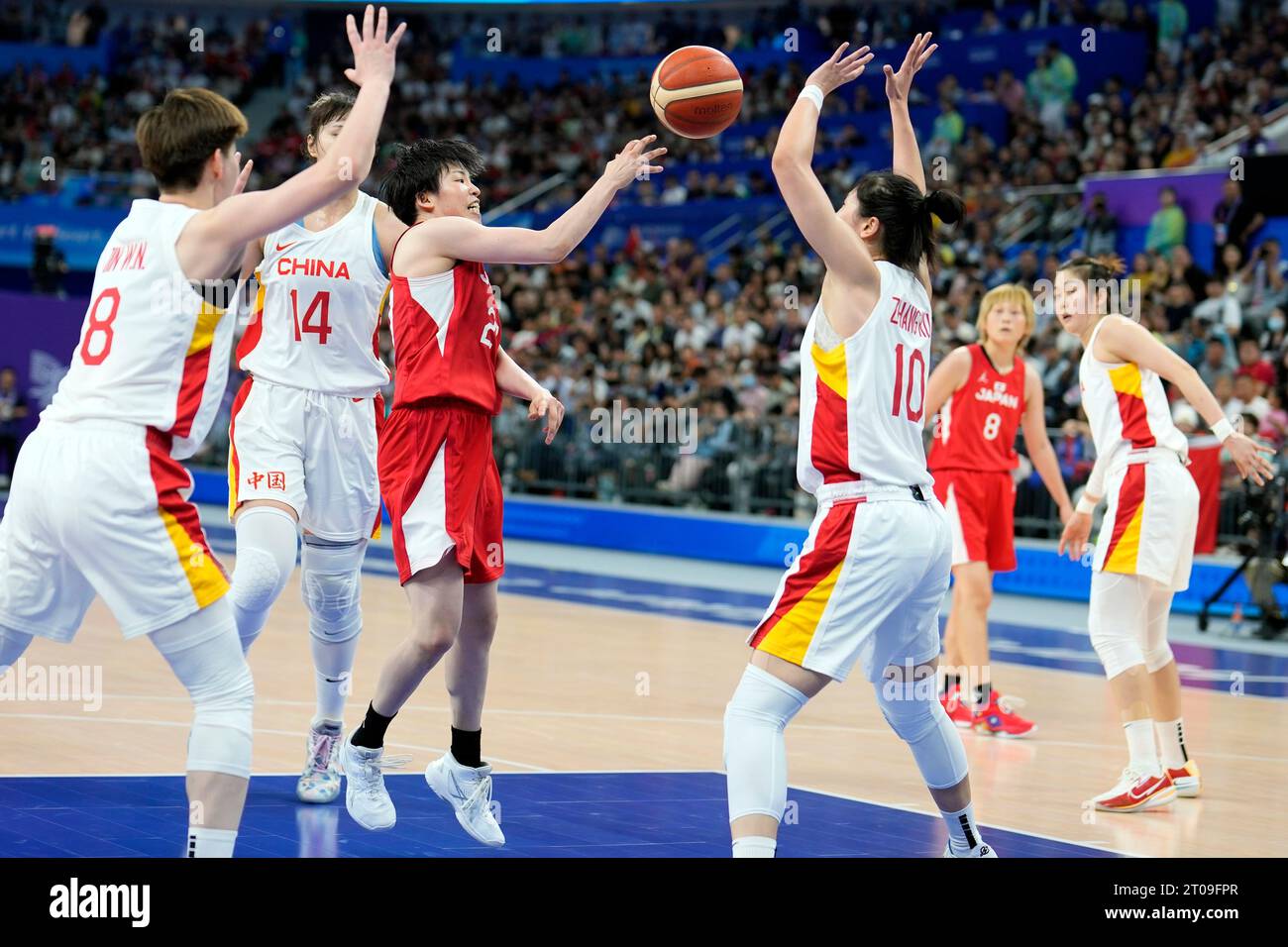 Japan's guard Saki Hayashi (27) passes the ball though China's forward ...