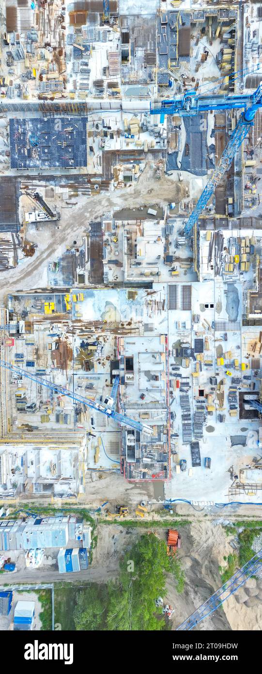 Aerial Bird Eye View Of a Construction Site Building Cranes Looking ...