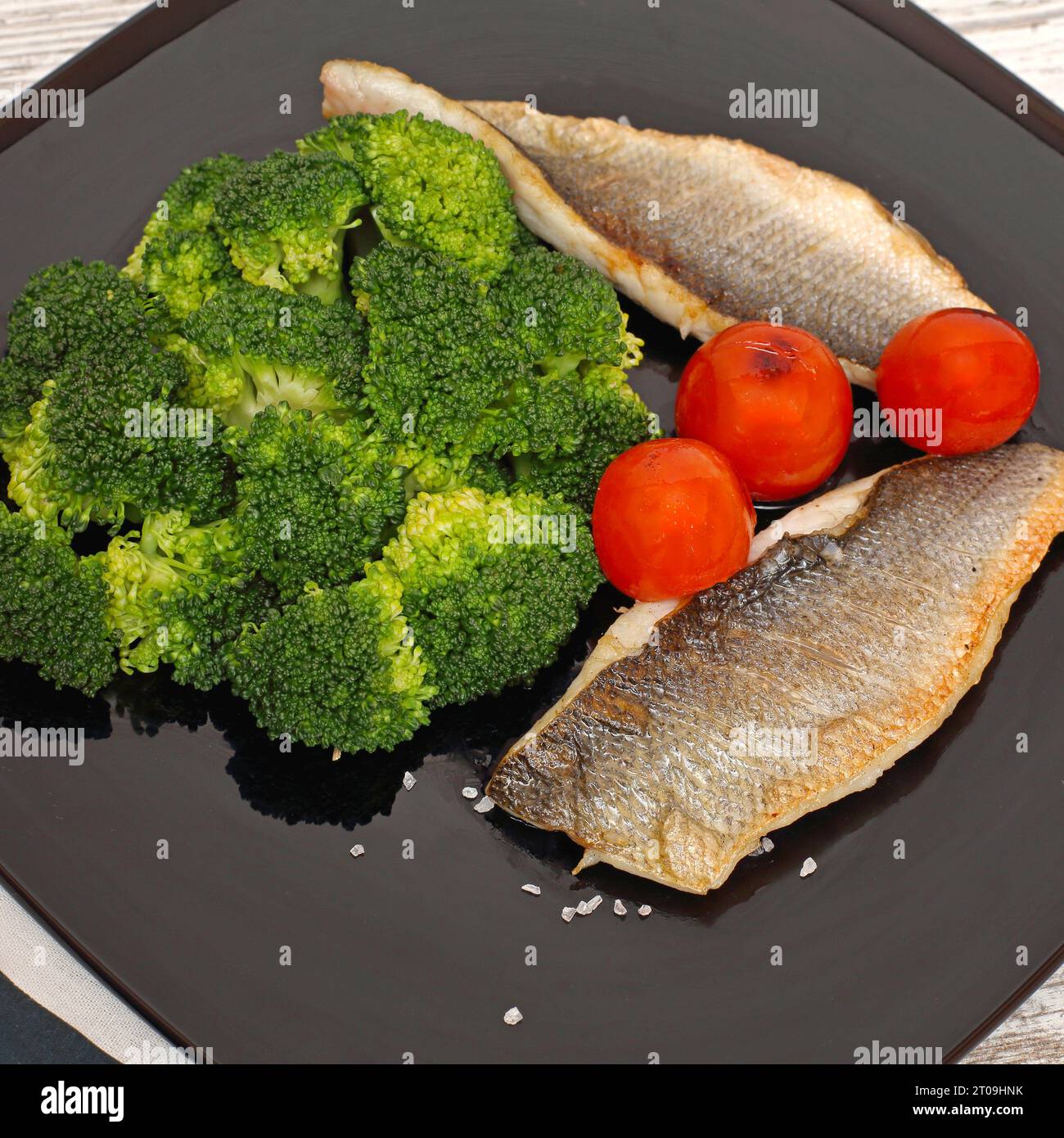 Grilled Fish Fillets With Broccoli Cherry Tomatoes at Black Plate Stock ...
