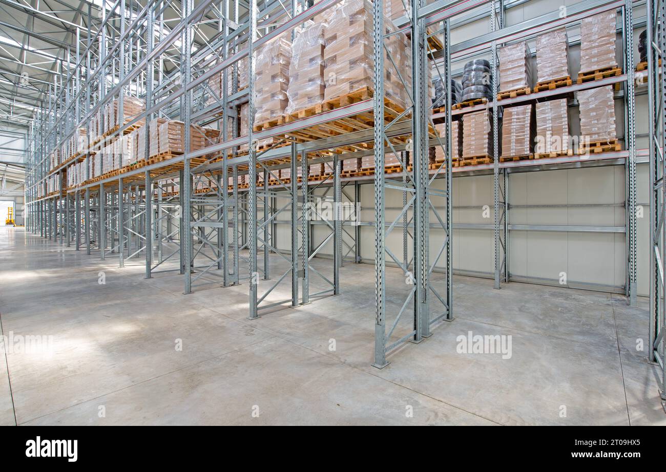 Pallet Rack With Goods in Distribution Warehouse Stock Photo - Alamy