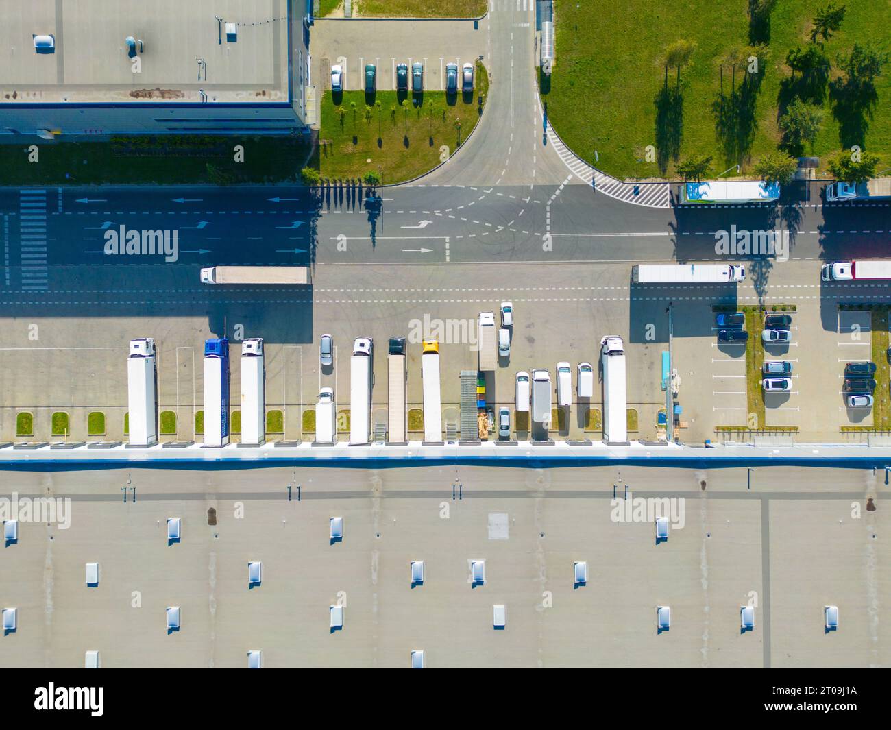 Logistics park with warehouse. Semi-trailers trucks standing on car ...