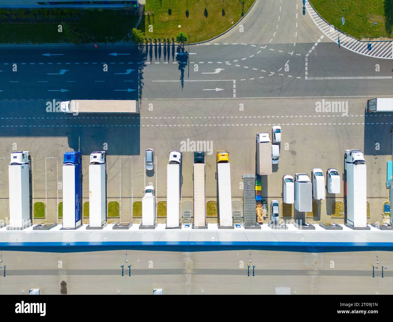Logistics park with warehouse. Semi-trailers trucks standing on car ...