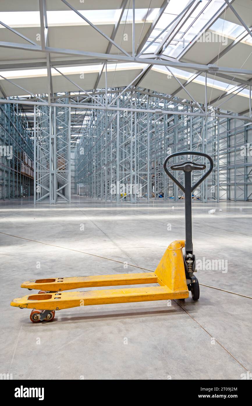 Manual Pallet Jack Truck in Distribution Warehouse Stock Photo - Alamy