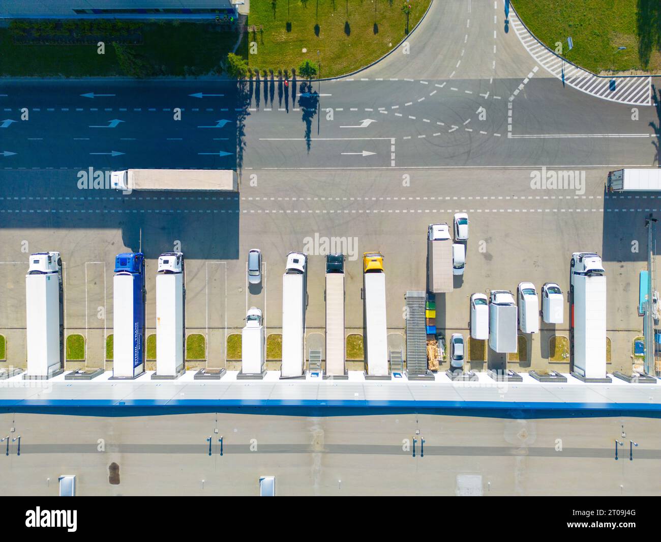 Logistics park with warehouse. Semi-trailers trucks standing on car ...