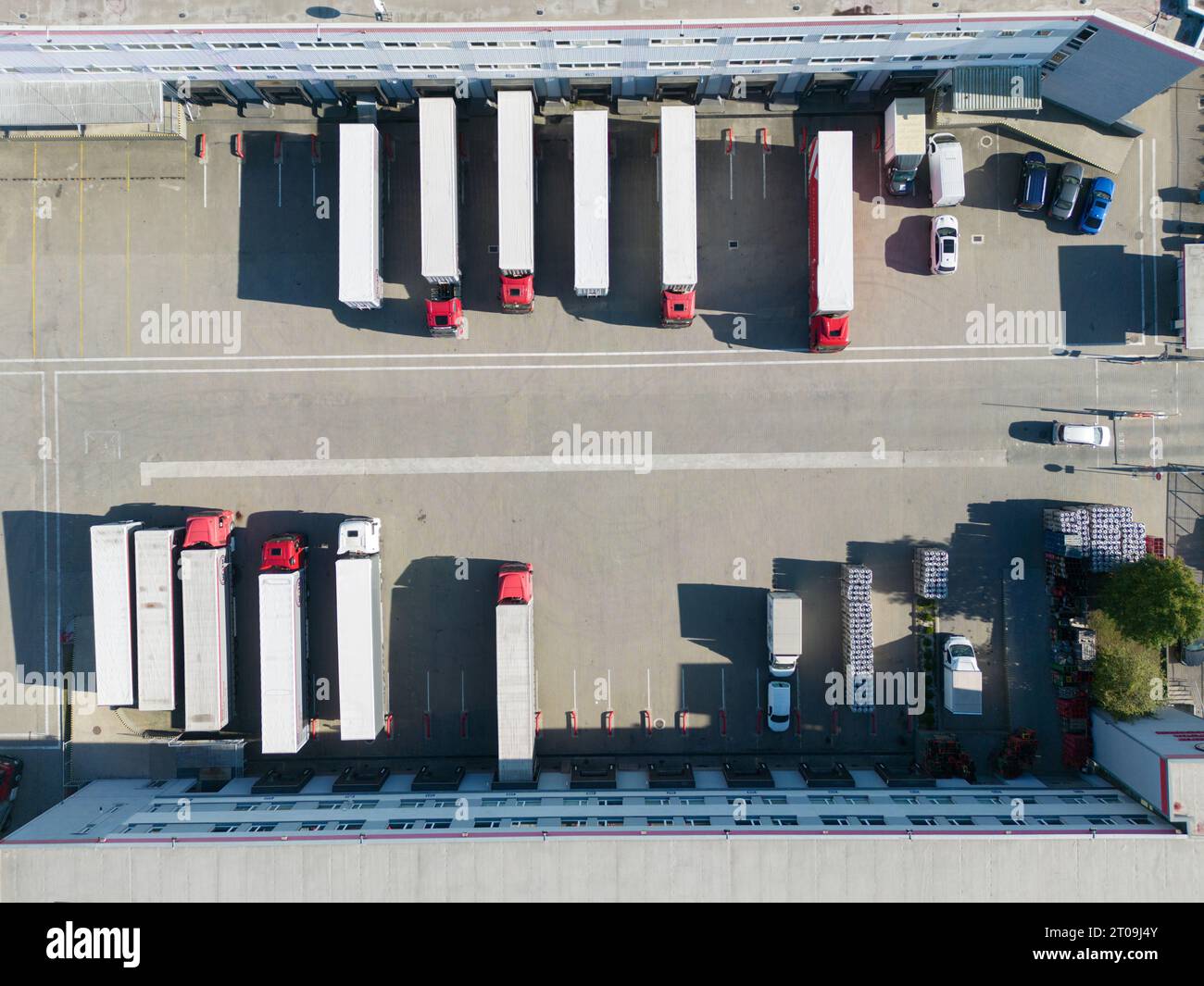 Logistics park with warehouse. Semi-trailers trucks standing on car ...